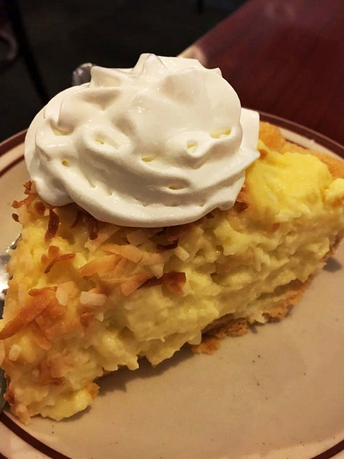 Coconut cream pie with a cloud of whipped cream&mdash;the kind of dessert that makes you temporarily forget your name. 