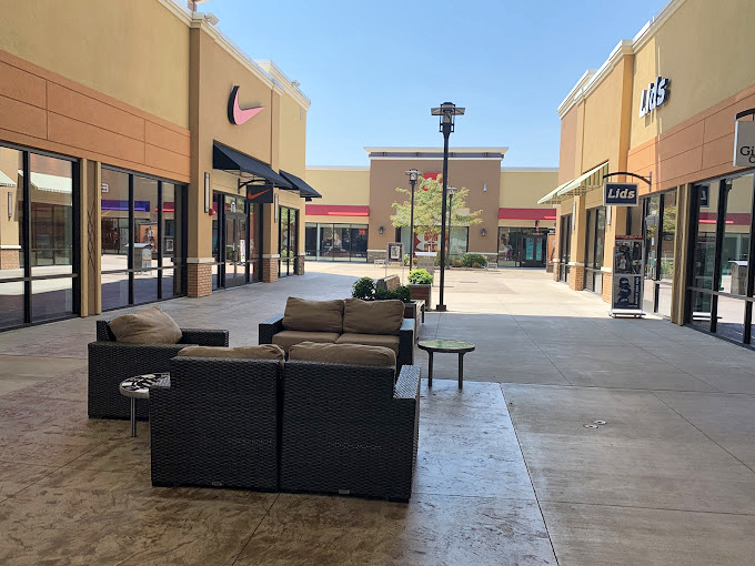 These comfortable lounge areas scattered throughout the outlets are what I call "husband habitats"—perfect for resting while others continue the bargain hunt.