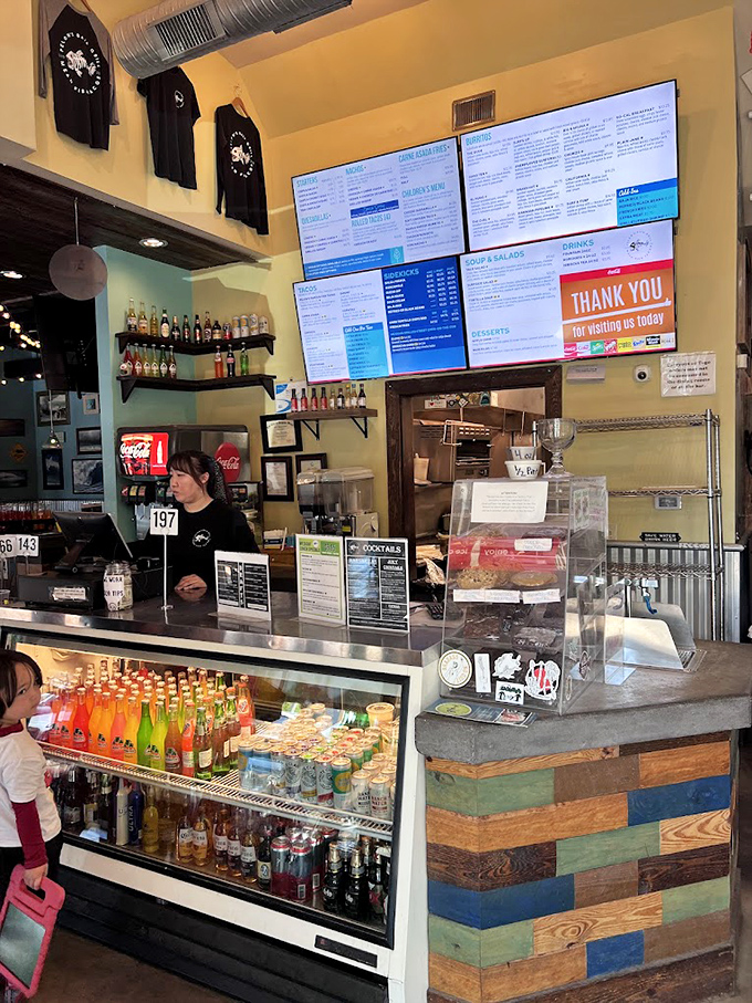 Behind this counter, taco dreams come true. It's like Willy Wonka's factory, but with salsa instead of chocolate.