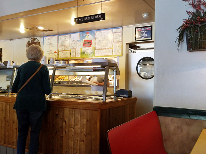 The moment of truth at the ordering counter. That "Place Orders Here" sign might as well read "Abandon Diet All Ye Who Enter Here."