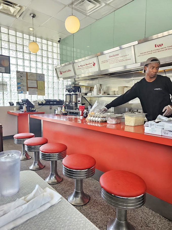 The counter&mdash;where diner magic happens before your eyes. Those red stools have witnessed countless coffee refills and life-changing breakfast decisions.