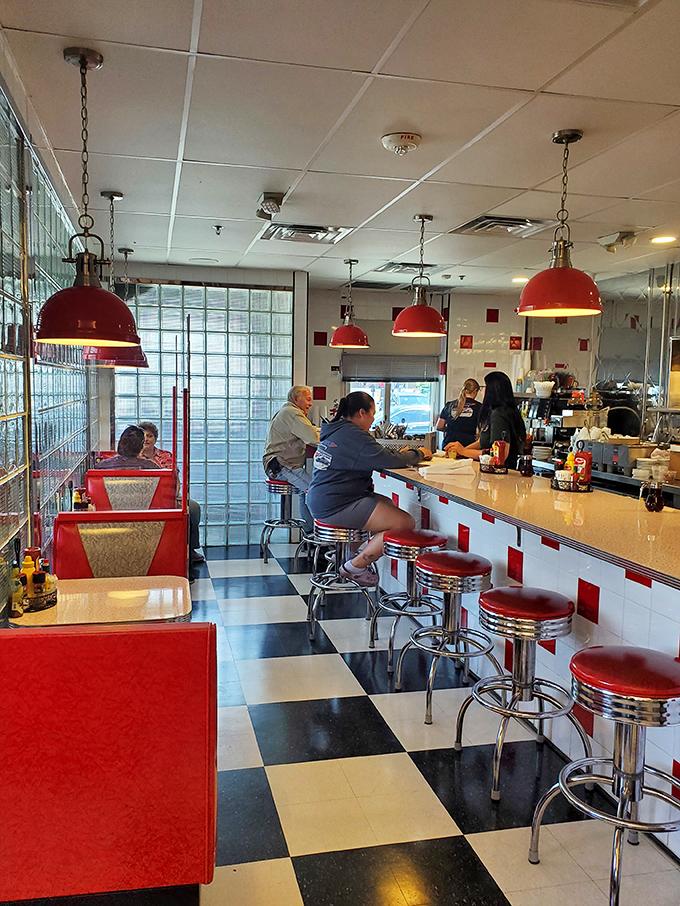 The counter seating&mdash;where diner magic happens. Watch short-order cooking ballet while perched on those classic red swivel stools that make everyone feel like a kid again.