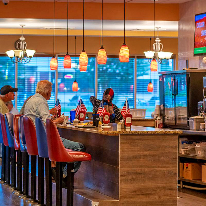 Counter seating&mdash;where diner magic happens. Those pendant lights cast the perfect glow for both early morning coffee and late afternoon pie deliberations.