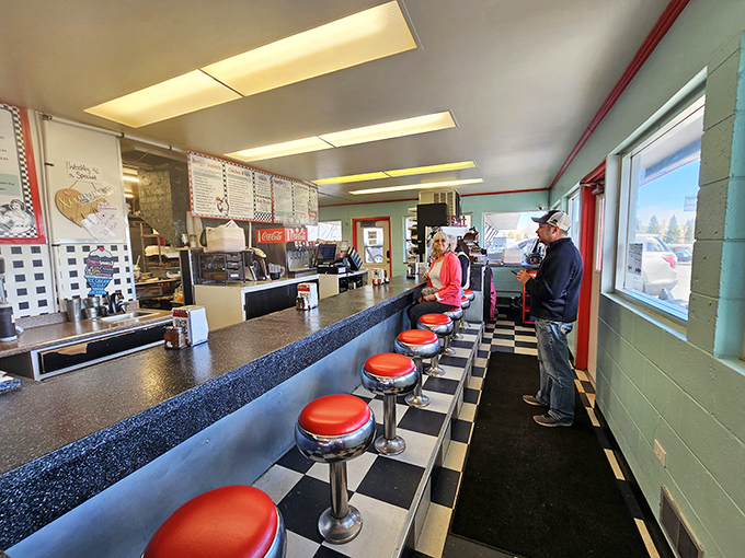 The counter seating&mdash;where solo diners become part of the Frostop family and every stool tells a story of satisfied customers past.