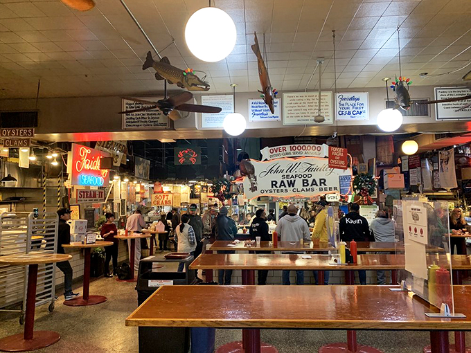 The standing counters at Faidley's aren't just furniture&mdash;they're community gathering spots where strangers become friends over shared crab cake euphoria.