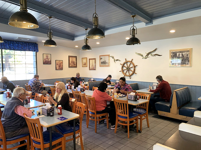 The dining room hums with the satisfied murmurs of people who've discovered what seafood is supposed to taste like. Those nautical decorations aren't kitsch&mdash;they're earned.