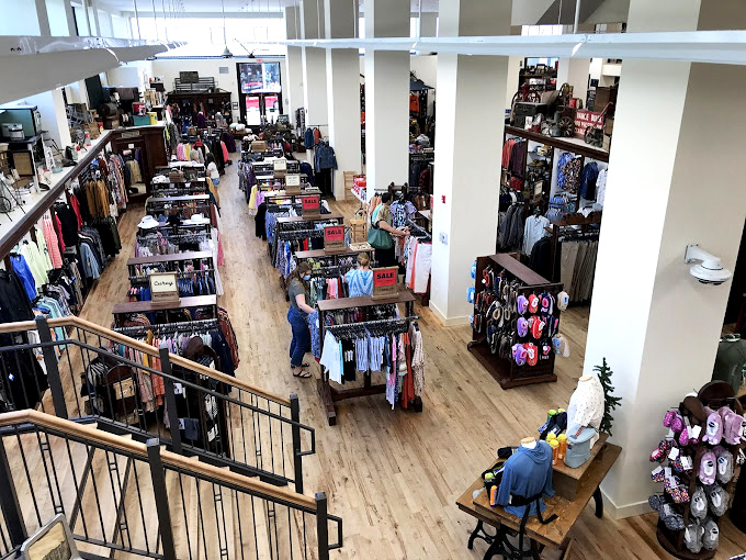 From this bird's-eye view, the store unfolds like a living museum of retail therapy where shoppers navigate aisles in search of both nostalgia and necessity.
