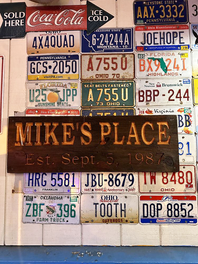 The wall of license plates tells stories of travelers from across America who found their way to Mike's Place. A mosaic of journeys ending at one delicious destination.