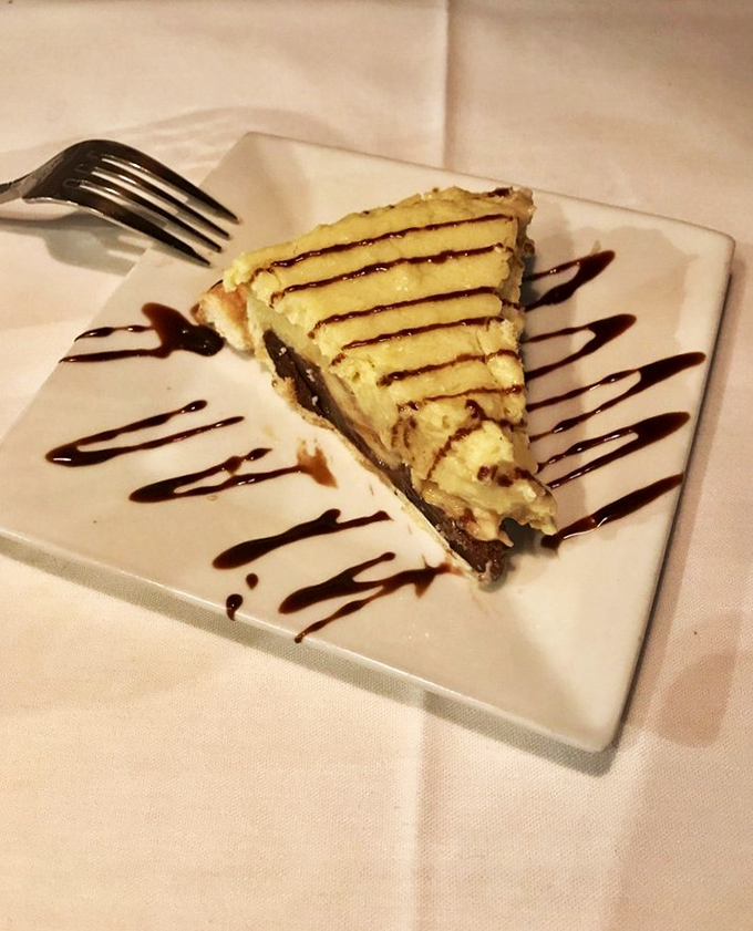 A slice of cheesecake artfully drizzled with chocolate says, "Yes, you absolutely deserved this." Your diet can resume tomorrow&mdash;or whenever this delicious memory fades.