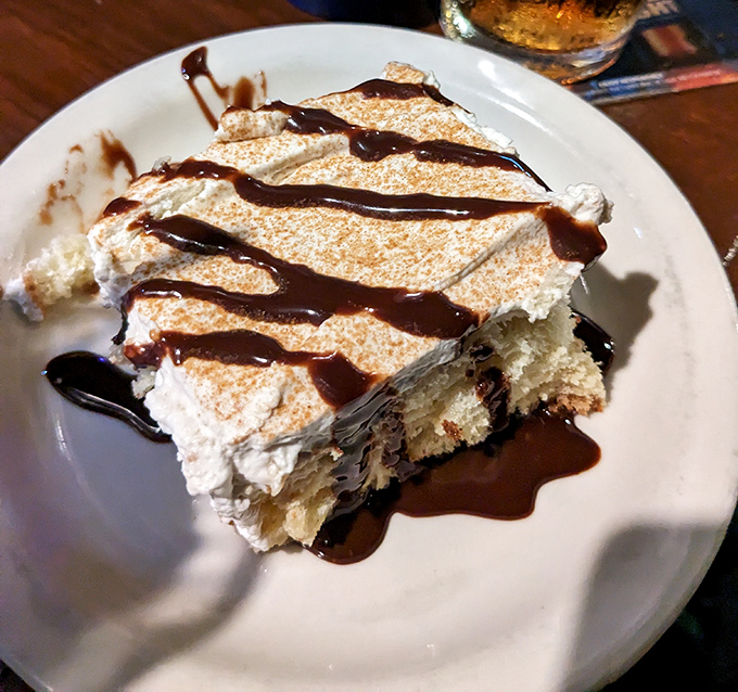 A dessert that doesn't just end the meal—it provides the exclamation point. That chocolate drizzle is writing love letters to your taste buds.