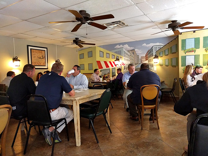 A dining room filled with the beautiful symphony of clinking glasses, full plates, and the satisfied murmurs of people eating really good food.