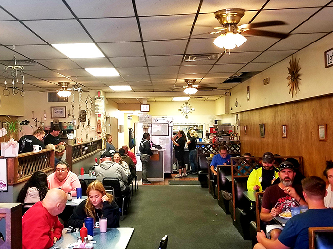 The weekend morning battlefield—where coffee flows freely and conversations bounce between booths like friendly artillery.