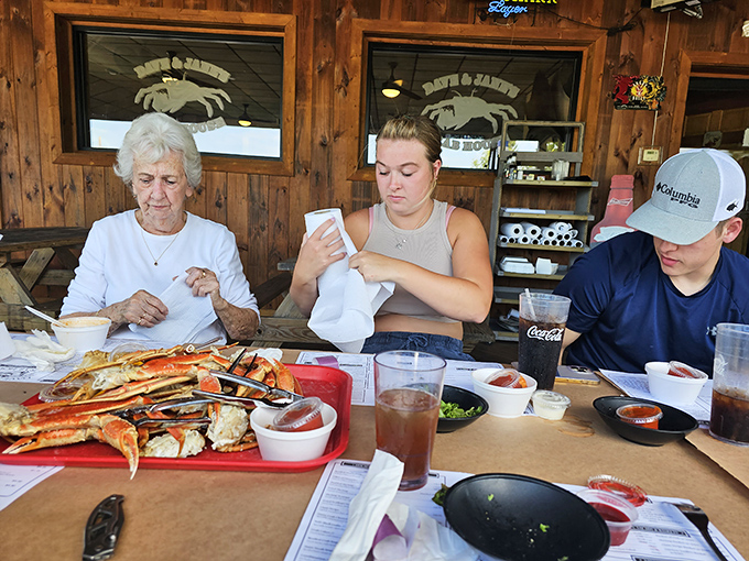 The true mark of great seafood: complete concentration on the task at hand. These diners know that crab legs require focus and dedication.