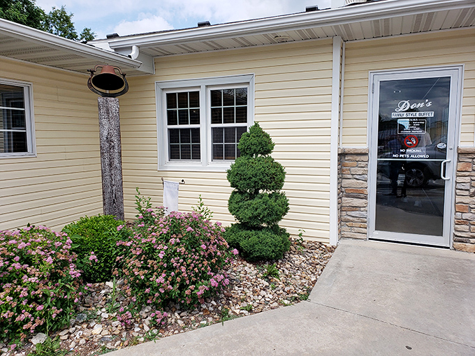Even the landscaping has that careful "someone's grandma is in charge" vibe—just enough manicured shrubs to let you know they care about details.