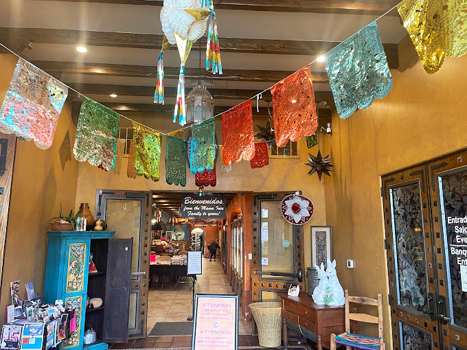 The entrance, framed by vibrant flowers, serves as a portal between everyday Indiana and a slice of Mexico. No passport required. 