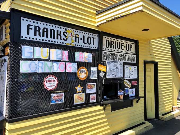 A drive-thru for when your hot dog cravings can't wait for parking. The yellow building practically glows with the promise of satisfaction. 