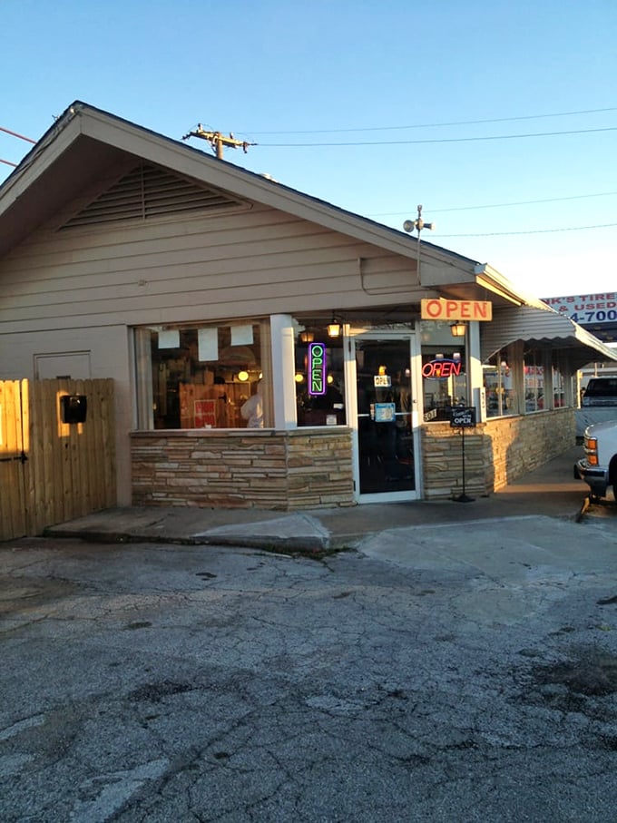 As evening approaches, those neon "OPEN" signs glow like beacons of hope. The stone facade says "humble," but the aroma screams "legendary."