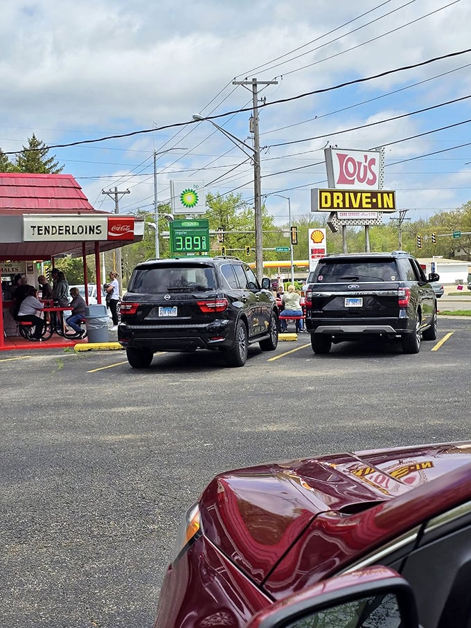 Cars line up like pilgrims at a shrine, each driver knowing that some traditions are worth every minute of the wait.