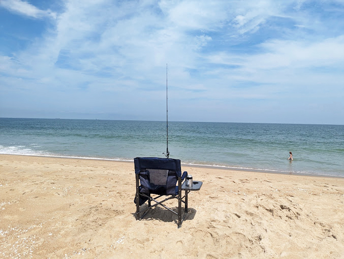 The quintessential fishing scene: one chair, one rod, endless patience, and the meditative relationship between angler and ocean.