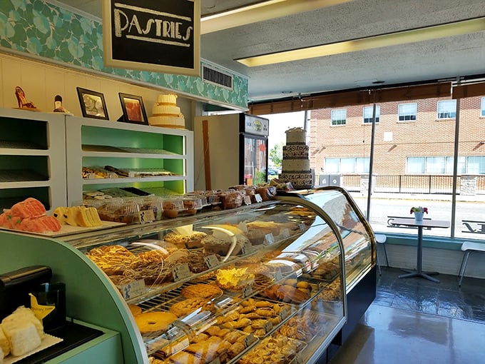 Bing's display case—a museum of flour and sugar where masterpieces are admired briefly before being devoured with coffee and zero regrets.
