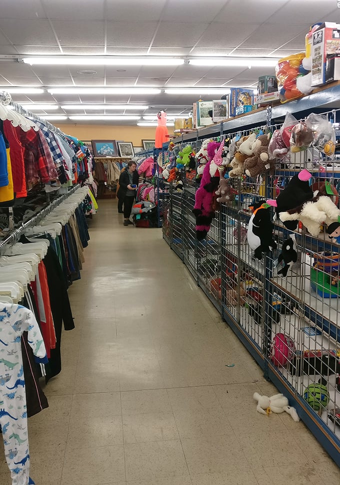 The children's section: where stuffed animals stand guard over tiny outfits, waiting for the next generation of imaginative adventures.