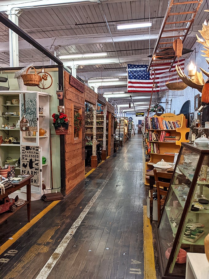 Wooden floors worn smooth by generations of mill workers now guide antique hunters down aisles where every booth offers a new adventure.