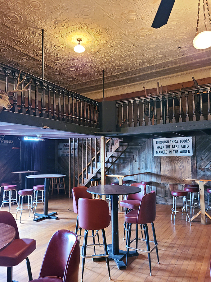 Vintage tin ceiling, wooden balcony, and burgundy bar stools&mdash;this space feels like it has stories to tell. If walls could talk, these would brag about the steaks.
