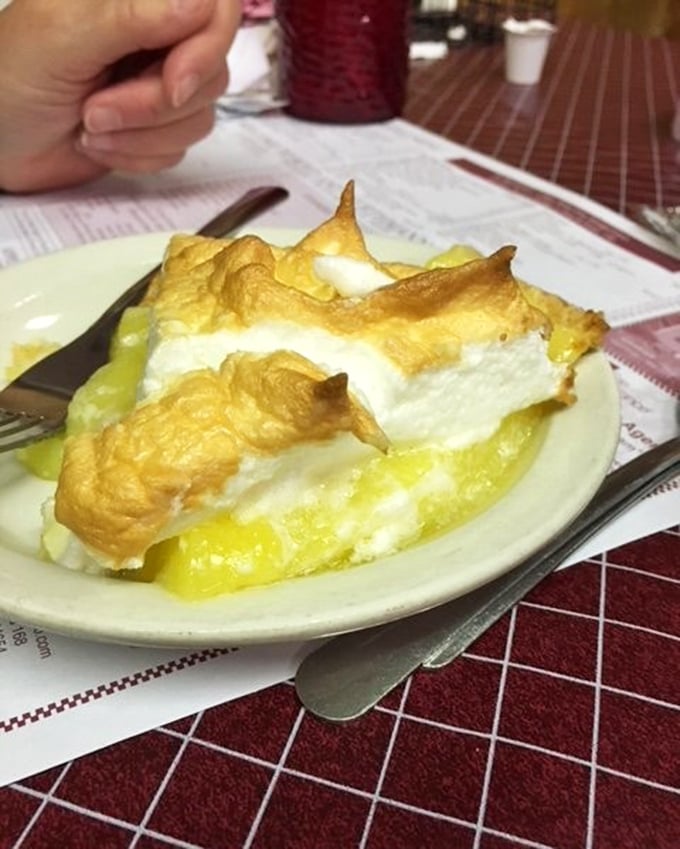 Lemon meringue pie with peaks so perfectly browned they could make a pastry chef weep. The sweet-tart filling beneath is sunshine on a plate. 