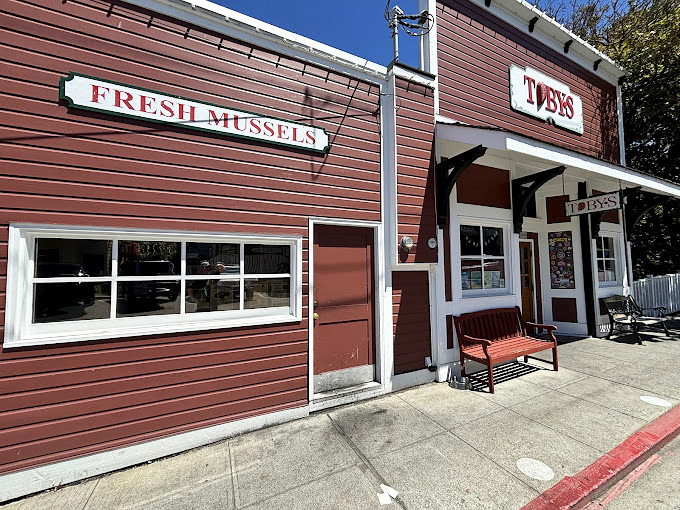 Toby's Tavern proudly announces its fresh mussels, a siren call to seafood lovers seeking Penn Cove's famous briny treasures.