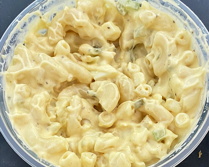 This isn't just macaroni salad; it's a creamy, comforting side that knows its job is to cool your palate between bites of that legendary fried chicken.
