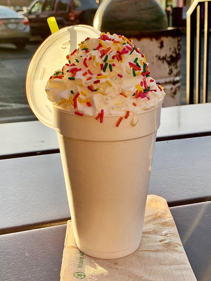 A milkshake topped with rainbow sprinkles because sometimes adulthood needs a little childhood magic. Thick enough to make your straw stand at attention.