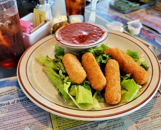 Mozzarella sticks: the universal language of comfort. These golden-brown beauties come with marinara that could make an Italian grandmother nod approvingly.