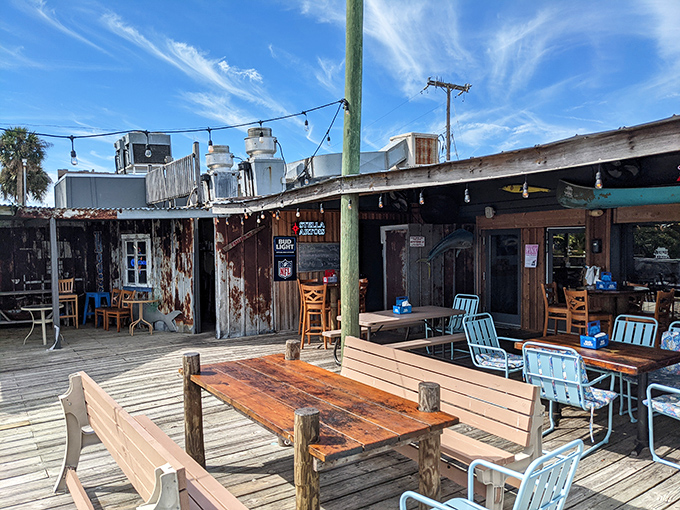 Weathered wood, mismatched furniture, and water views that no interior designer could improve upon. This is Florida dining in its natural habitat.