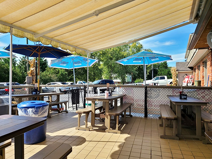 The outdoor seating area&mdash;where summer breezes carry the scent of Old Bay and steamed crabs. Blue umbrellas match the Maryland blue crabs on your plate.