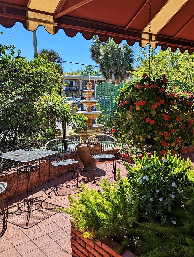A garden oasis where fountain sounds mix with the clink of forks on plates. Florida dining as it should be—lush, relaxed, and utterly civilized.