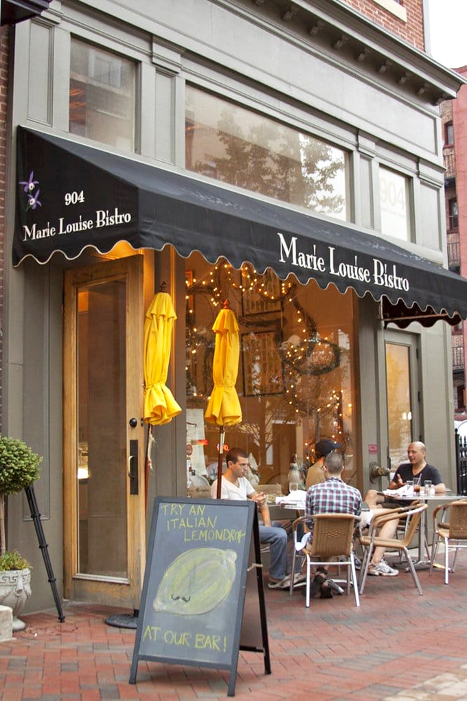 The storefront says "authentic French bistro" while the sidewalk seating whispers, "Linger here with a glass of wine and watch Baltimore stroll by."