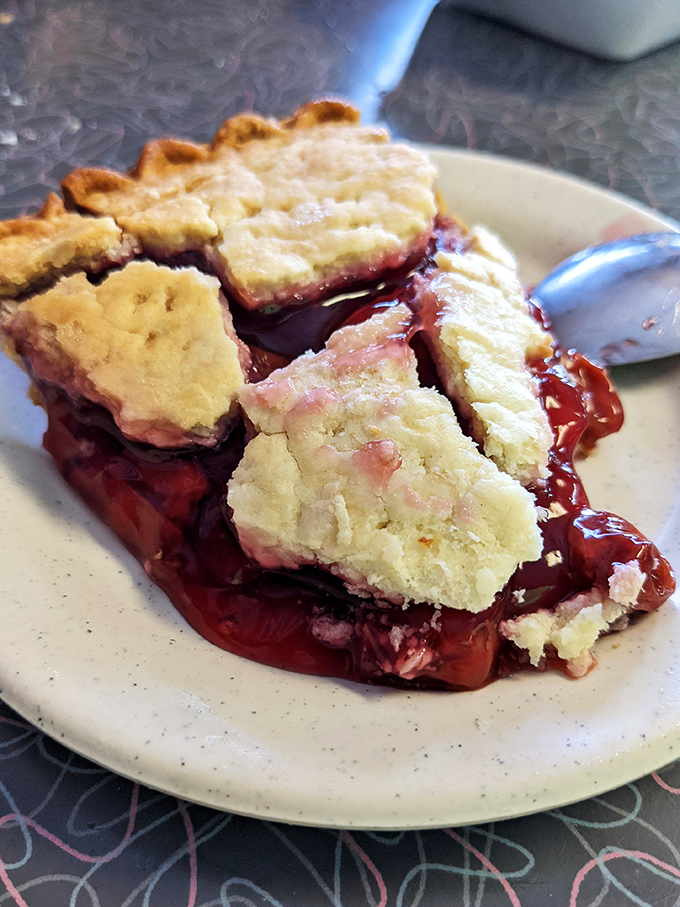 This cherry pie isn't just dessert—it's edible nostalgia. The slightly imperfect crust tells you it was made by human hands that understand the importance of butter.