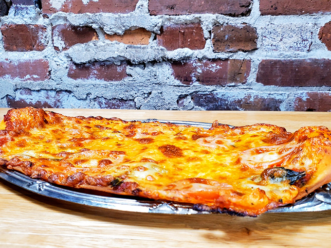 Ambrosia's rustic brick walls provide the perfect backdrop for their golden, bubbling flatbread – a savory counterpoint to their sweet offerings.