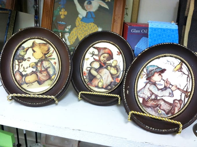 Vintage decorative plates featuring whimsical characters&mdash;wall art that once adorned grandma's dining room now ready for your ironic kitchen display.