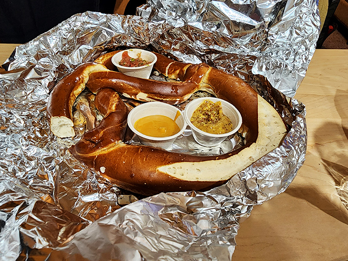 A pretzel ring that's less "mall food court" and more "why aren't all pretzels served with dipping sauces and this much love?"