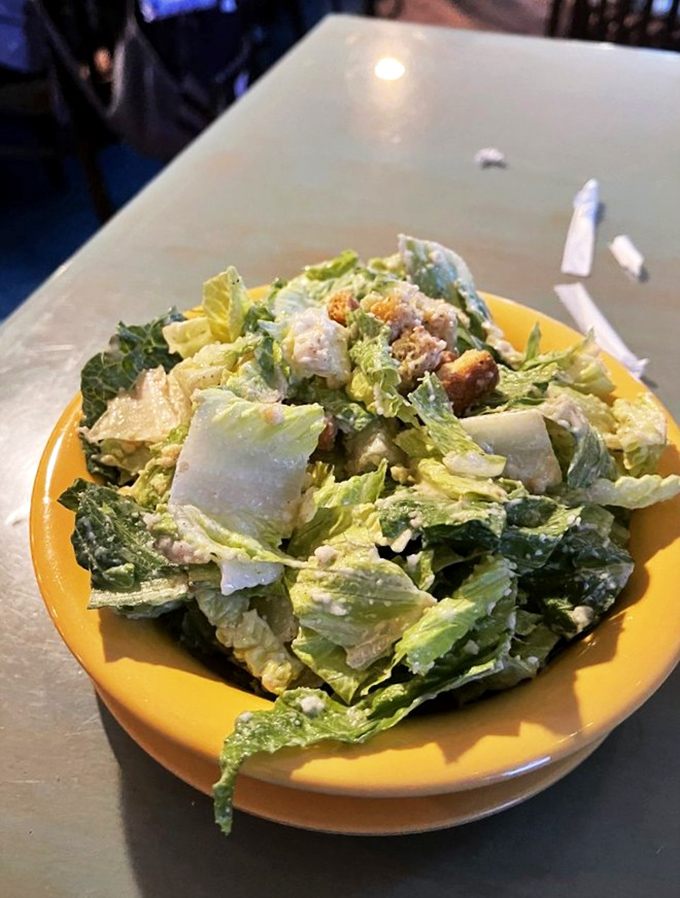 Caesar salad: the supporting actor that steals the scene. Those crisp romaine leaves are just boats for delivering perfect dressing to your taste buds.