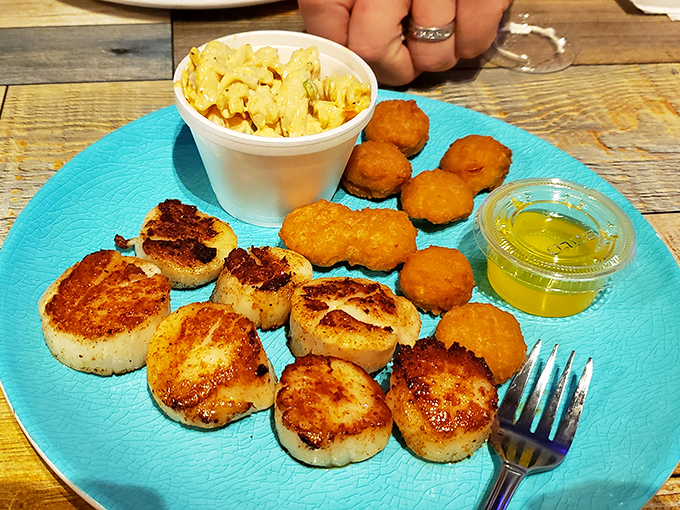 Perfectly seared scallops with golden-brown hush puppies&mdash;a plate that proves inland West Virginia can absolutely nail coastal cuisine.