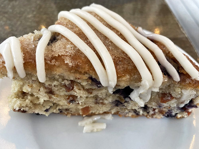 Not just a scone&mdash;a sweet masterpiece of crumbly perfection. The cream cheese drizzle is like the autograph of a pastry artist.