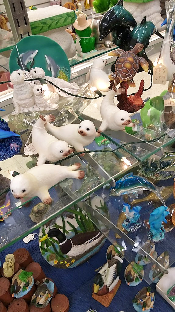 A family of ceramic seals shares display space with turtles and dolphins, creating an adorable underwater menagerie that's impossible to resist.