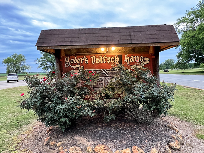 The rustic wooden sign, framed by roses, stands as a beacon of hope for hungry travelers&mdash;like a lighthouse, but for pie enthusiasts.