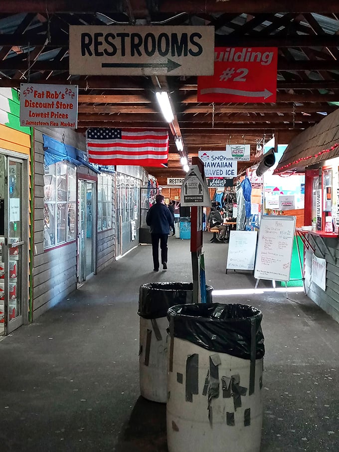The market's indoor thoroughfare, where American flags hang proudly and hand-lettered signs point the way to more discoveries.