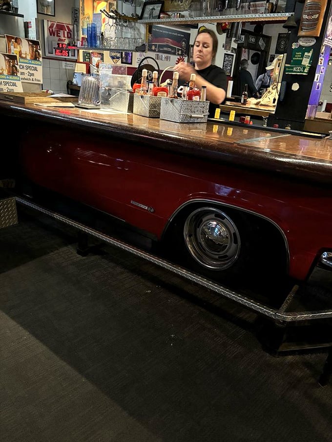 This bar isn't just serving drinks&mdash;it's a vintage car transformed into a counter. Automotive history and barbecue culture collide in perfect harmony.