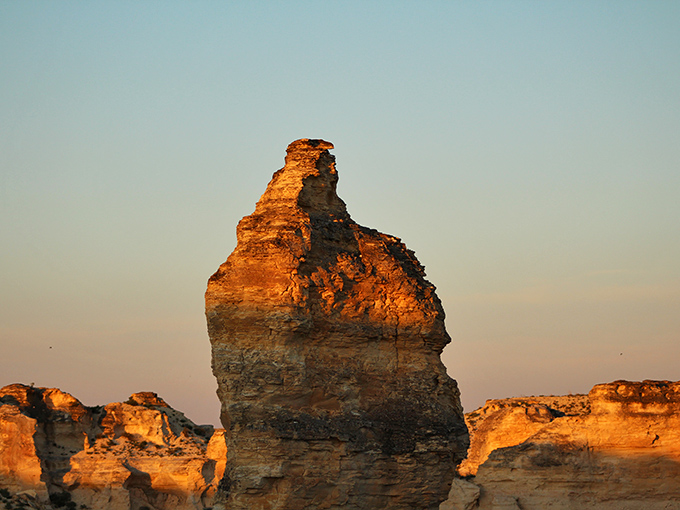 Sunset ignites a towering chalk spire, transforming ordinary limestone into a glowing beacon that would make any cathedral architect jealous.
