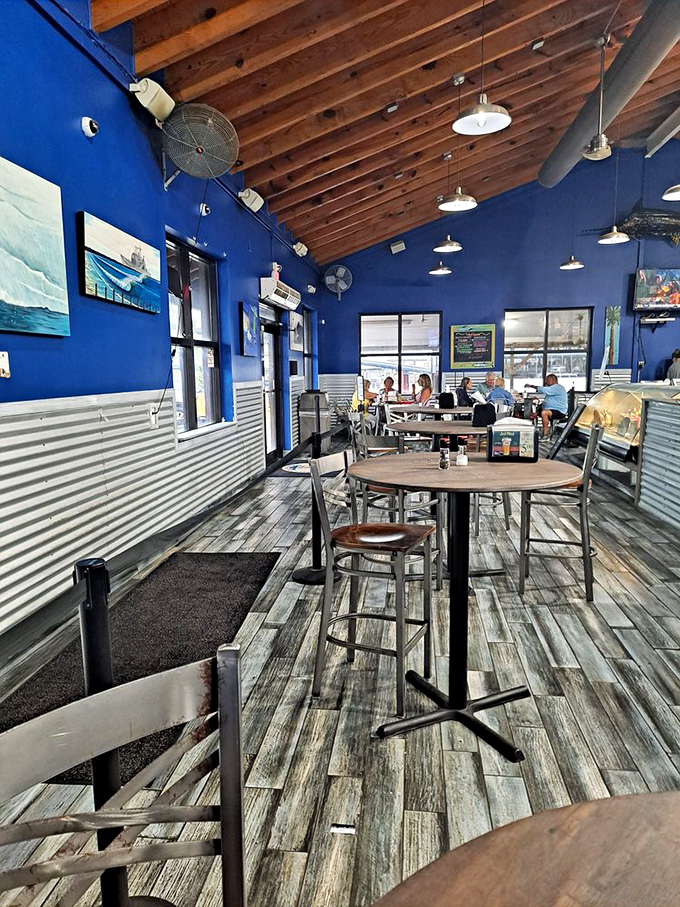 Blue walls that echo the nearby Atlantic, weathered wood floors that tell stories. Every table a front-row seat to seafood bliss.