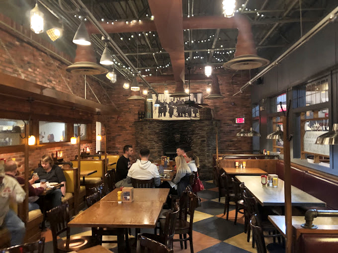 Exposed brick walls and wooden tables create an atmosphere where comfort food finds its perfect home&mdash;unpretentious and welcoming to all.